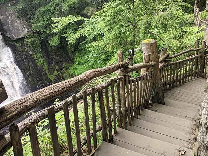 Rustic railings guide you safely down paths where every turn reveals another postcard-worthy view of cascading water.