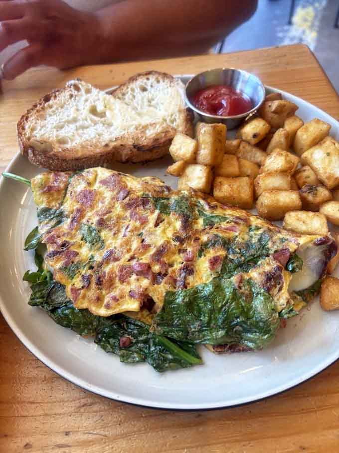 That omelette is stuffed so generously, it's practically bursting with pride over its own deliciousness and golden perfection.