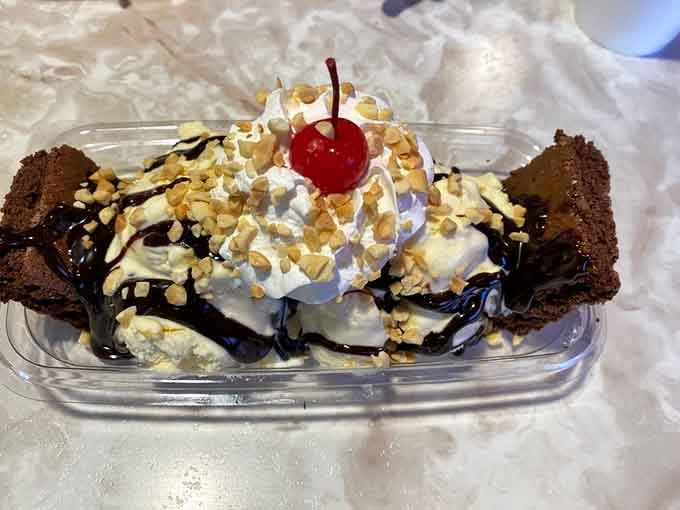 The Cruisin' Fudge Sundae with brownies, whipped cream, and nuts is basically happiness served in a plastic container.