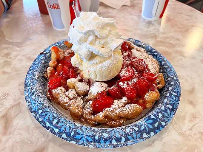 Funnel cake topped with strawberries and ice cream, because sometimes breakfast dessert needs to happen immediately.