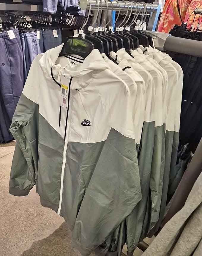 Windbreakers in sage and white hang ready to protect you from weather while looking effortlessly put-together and stylish.