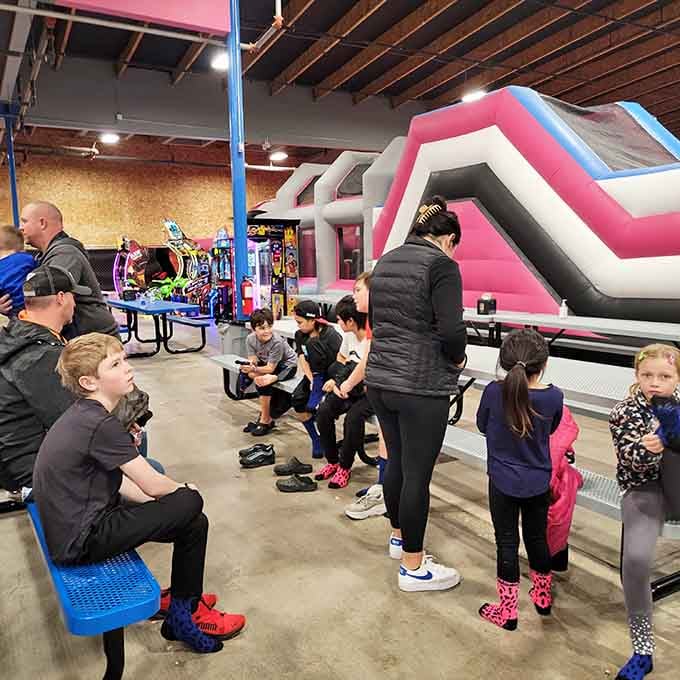 Families gather, grip socks on, ready to unleash energy that's been building since breakfast this morning.