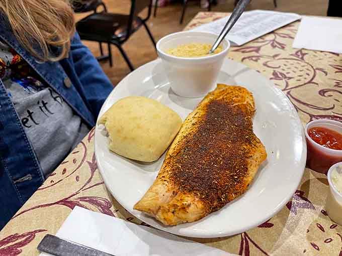 Blackened fish with a fluffy roll shows Cedar Lane's seafood game is absolutely no joke.