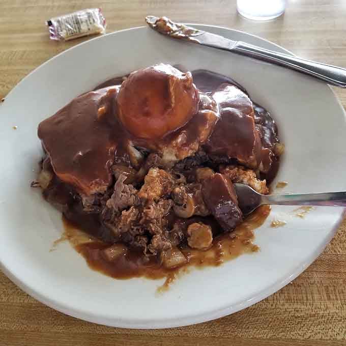 Hot beef sandwich swimming in gravy is the culinary equivalent of a warm blanket on a cold day.