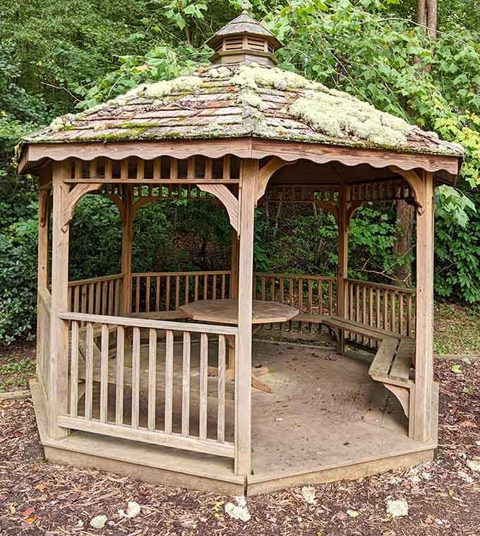 A gazebo that's seen more peaceful moments than your living room couch ever will, guaranteed.