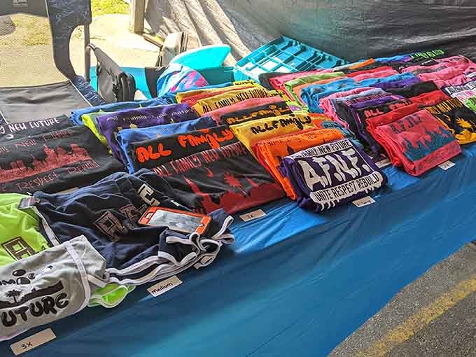 Graphic tees spread across tables like a canvas of pop culture, offering statements bolder than your nephew's social media posts.
