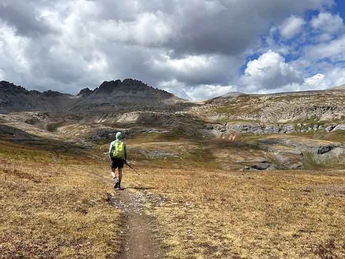 That tiny human figure really puts the "holy cow, these mountains are massive" perspective into sharp focus.