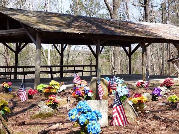 A rustic shelter watches over colorful blooms, proving love doesn't end when the last hunt is over and done.