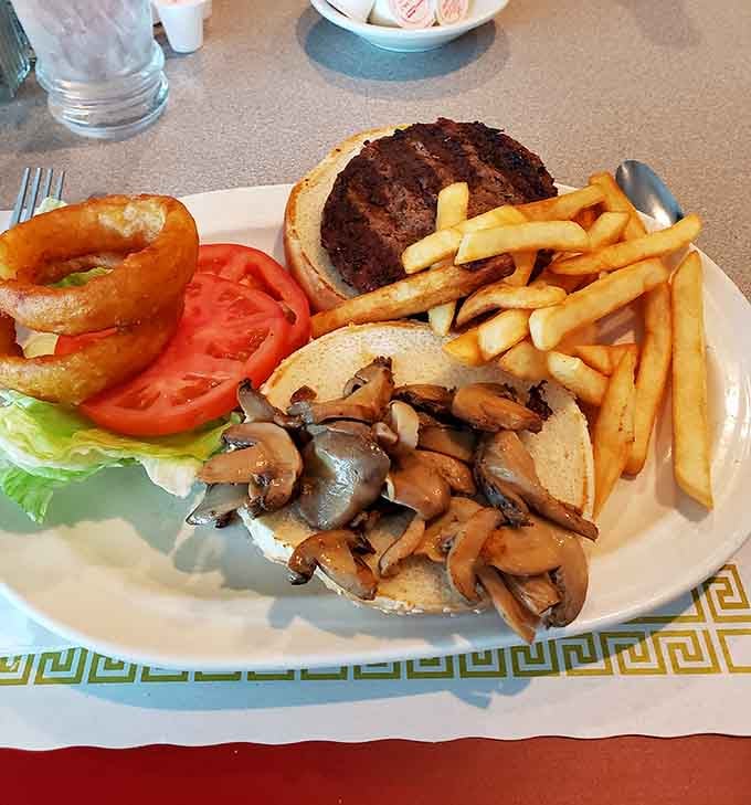 A burger this loaded with mushrooms and onions deserves its own standing ovation and maybe a nap.