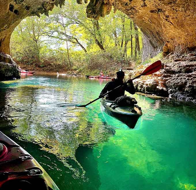 Kayaking through cave openings into glowing turquoise waters creates memories that last forever.
