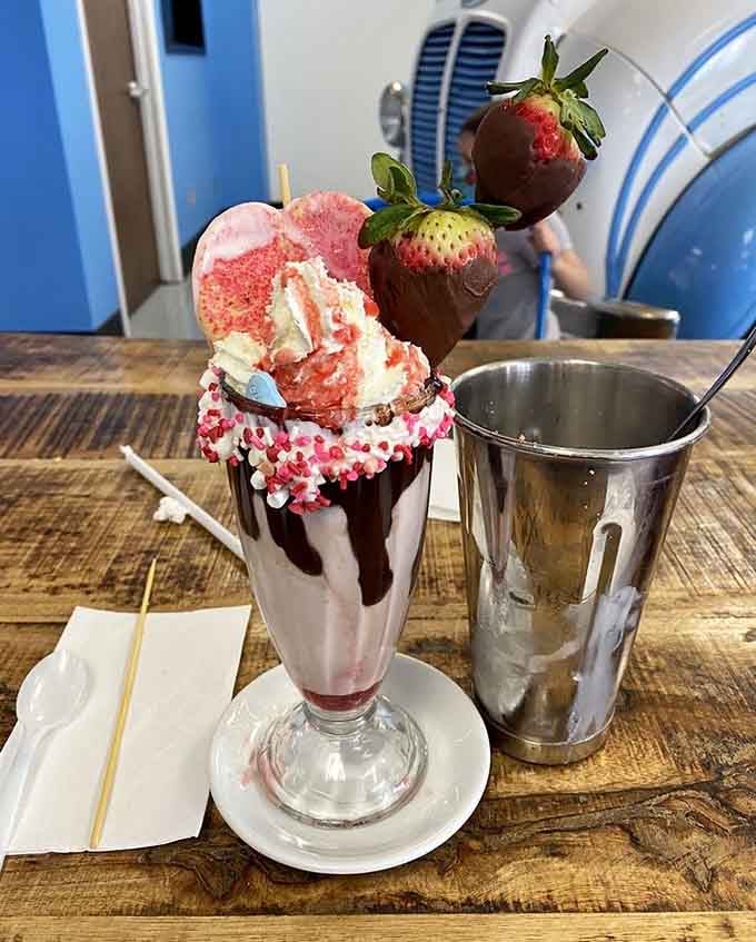 Chocolate-dipped strawberries crown this pink confection that's sweeter than a Valentine's Day card from 1955.