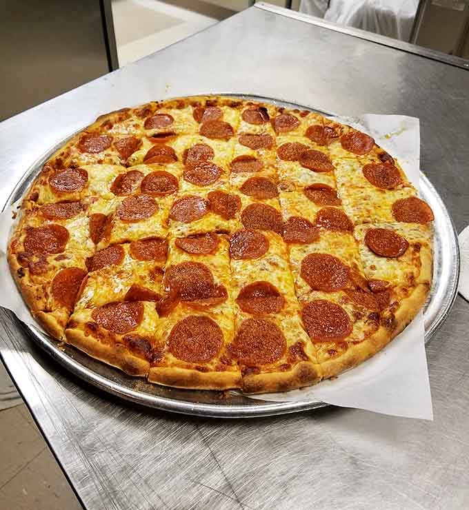 Perfectly placed pepperoni circles create a geometric pattern that would make mathematicians weep with joy and hunger.