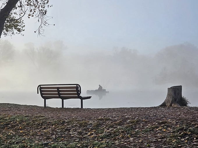 Morning mist creates an almost mystical scene where a lonely bench waits for someone to sit and contemplate life's mysteries.