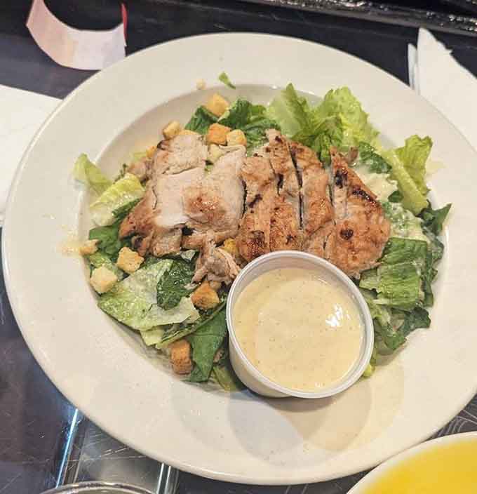Fresh greens, grilled chicken, and creamy dressing prove that even salads get the royal treatment here.