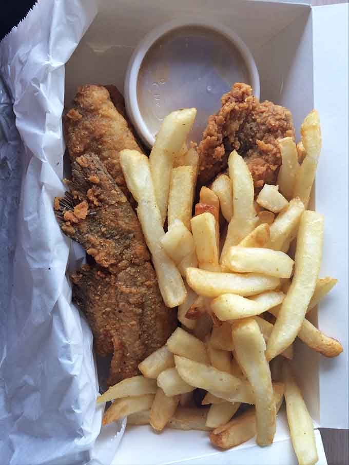 Crispy catfish paired with hot fries creates the kind of simple pleasure that reminds you why Southern cooking conquered America.