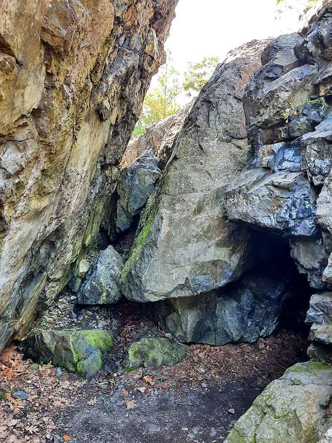 The rock formations around the cave entrance look like abstract art, if abstract artists worked in tons of granite.