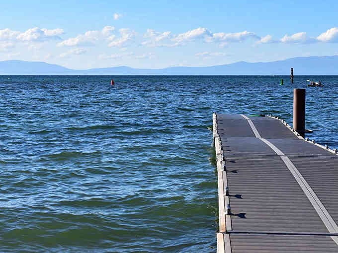 A dock stretches into blue infinity, inviting contemplation or just really good Instagram photos.