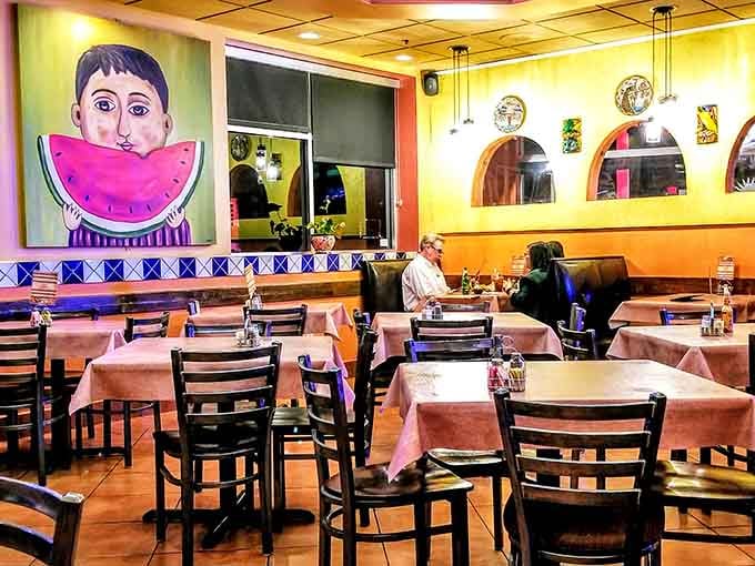 Notice how the vibrant artwork makes you feel like you're dining in someone's colorful, welcoming home.