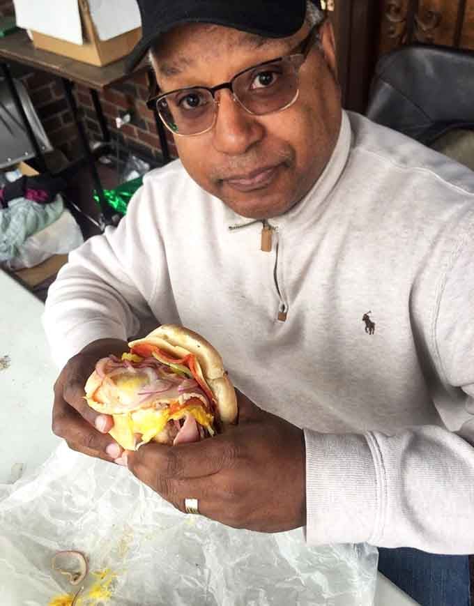 That smile says it all: this is what happens when you bite into a sandwich built with actual care.