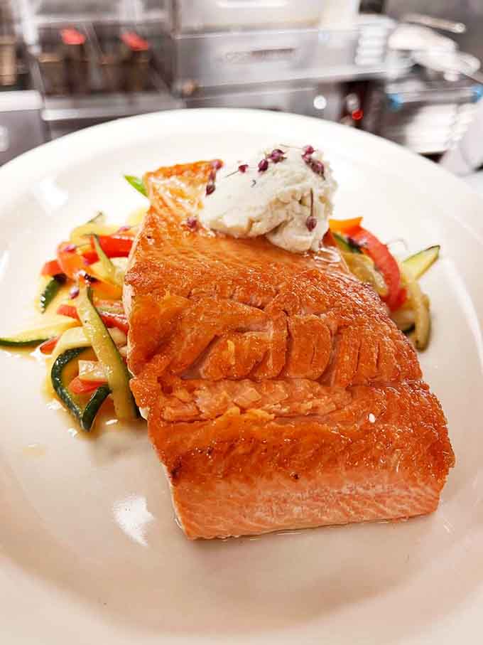 Even the salmon gets the royal treatment here, proving this kitchen respects all proteins equally.