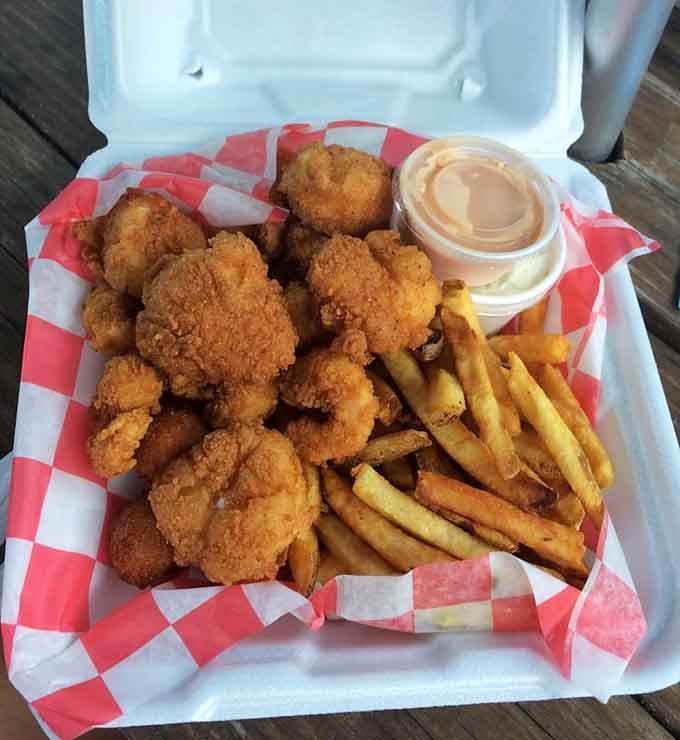 Fried scallops and shrimp with fries in a foam container: casual presentation, five-star taste, zero pretension involved whatsoever.