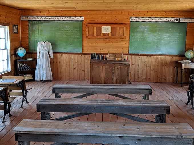 Green chalkboards and wooden benches in the schoolhouse where education happened without a single WiFi connection in sight.