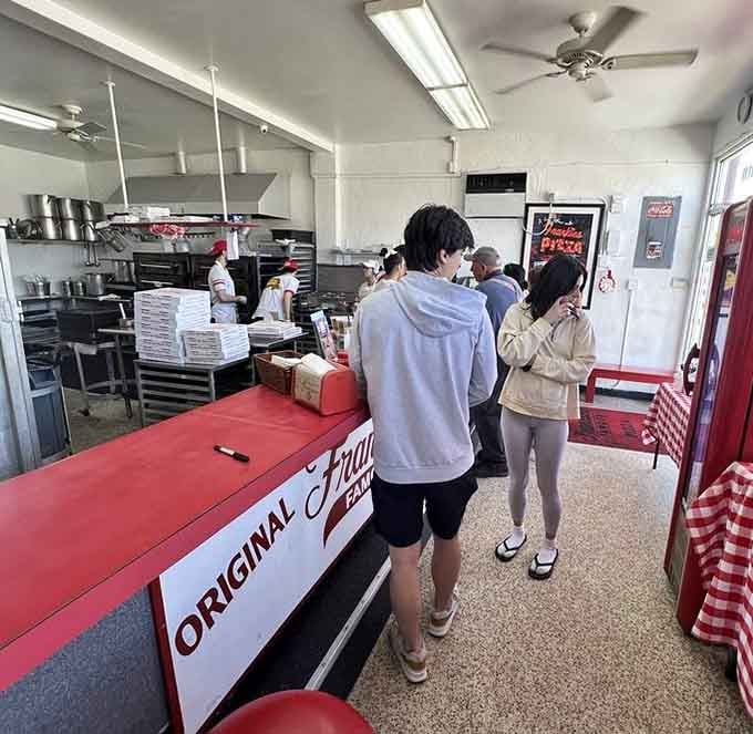 Real customers at the counter, not models or staged photos, just folks getting their Frankie's fix like always.