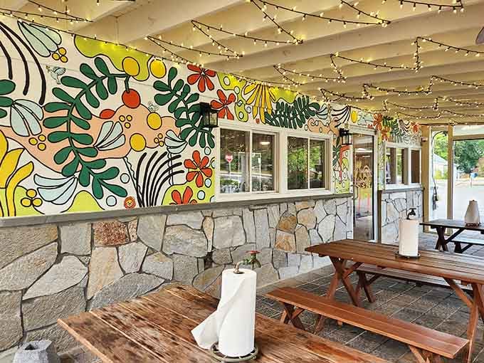 Vibrant murals and string lights transform outdoor dining into a cheerful celebration, because good chicken deserves a festive atmosphere.
