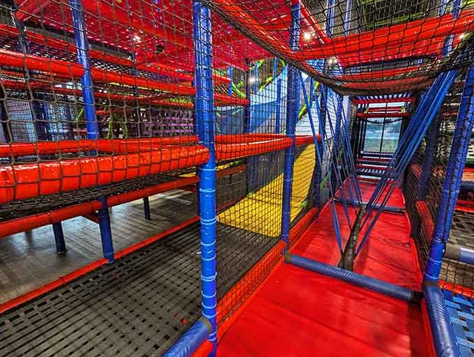 A maze of nets and tunnels where kids disappear and parents briefly question their life choices before relaxation sets in.