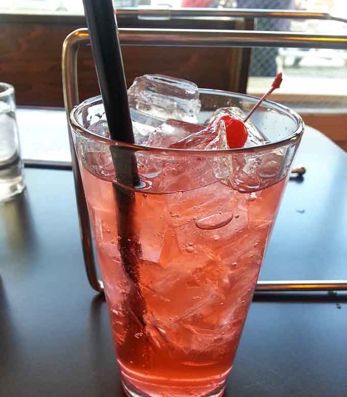 A cherry-topped cream soda that takes you back to simpler times, when happiness came in a glass.
