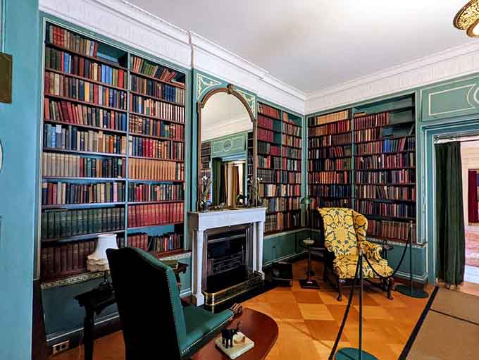 Floor-to-ceiling books in a turquoise library that would make Belle from Beauty and the Beast weep.