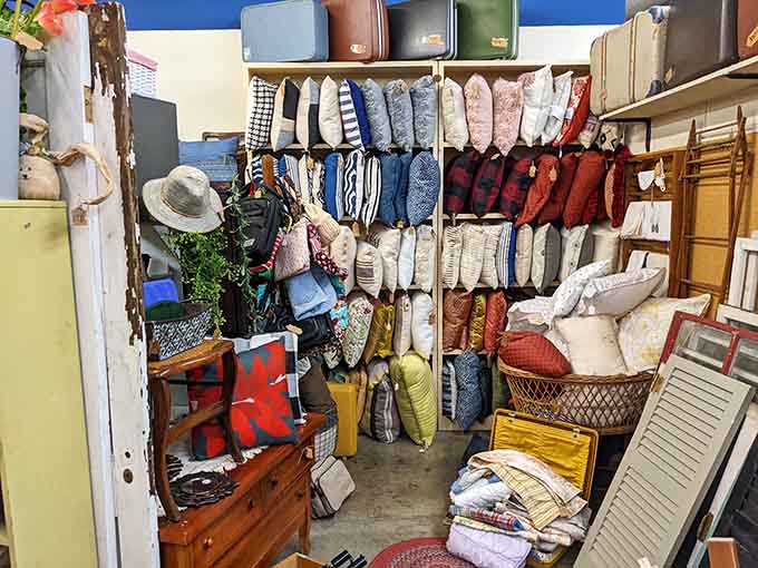 Cozy pillows stacked like a textile rainbow, each pattern telling its own decorative story beautifully.