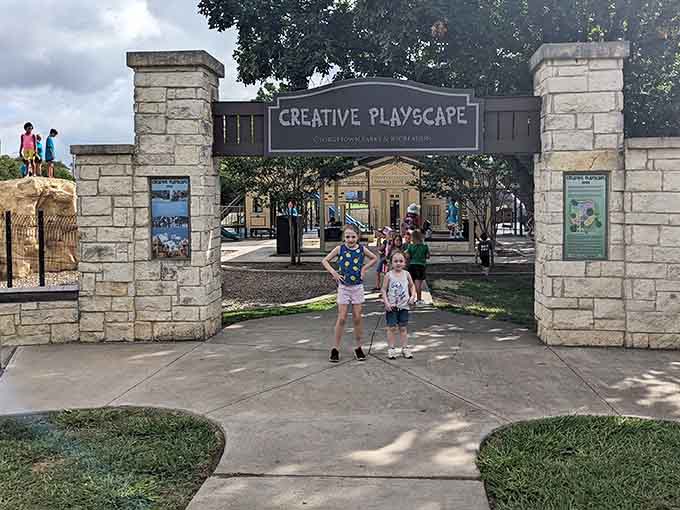 Stone pillars welcome families to a playscape where imagination runs wilder than the kids themselves do.