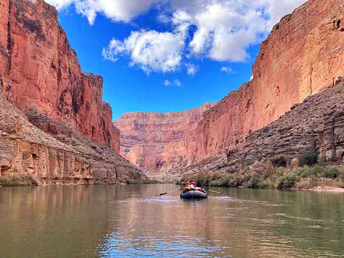 River rafters float through nature's cathedral, experiencing the canyon from a perspective few ever witness firsthand.