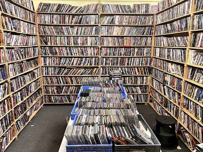 Floor-to-ceiling media means someone's entire movie collection awaits its next binge-watching enthusiast ready to go retro.