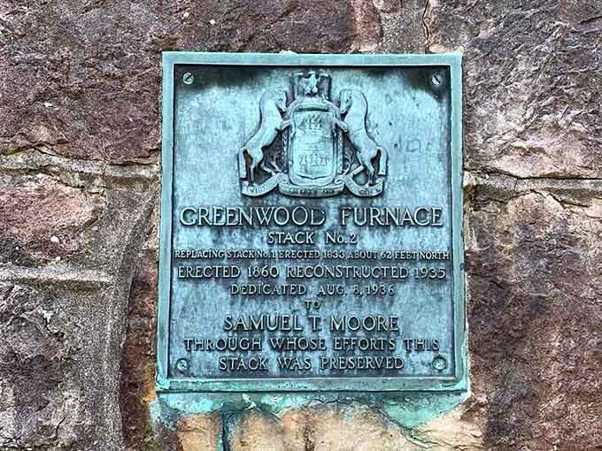 Historical marker tells the story of iron production that once made this valley echo with industry and ambition.