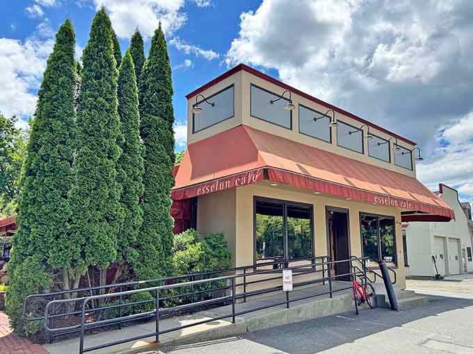 Those tall evergreens and welcoming awning create the perfect European-style caf&eacute; atmosphere for your morning cappuccino.