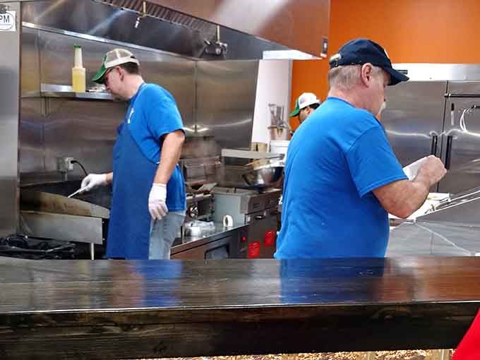Behind every great burger joint are folks in blue shirts making magic happen one patty at a time.