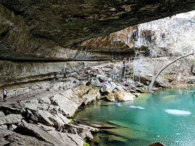 That turquoise water glows like liquid gemstone, fed by underground springs that keep temperatures refreshingly cool year-round.