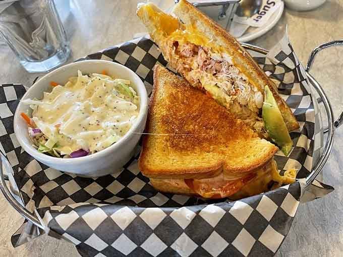 Toasted perfection holding generous crab filling that proves sandwiches can absolutely be considered fine dining when done right.