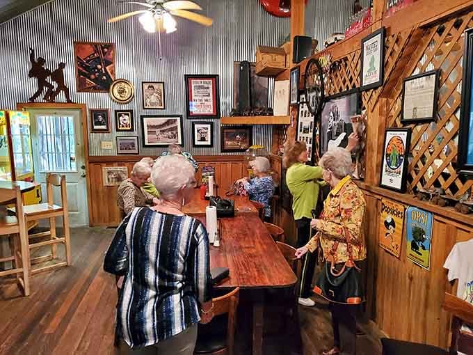 Locals gathering around communal tables, examining the walls like a museum exhibit while waiting for their order to arrive.