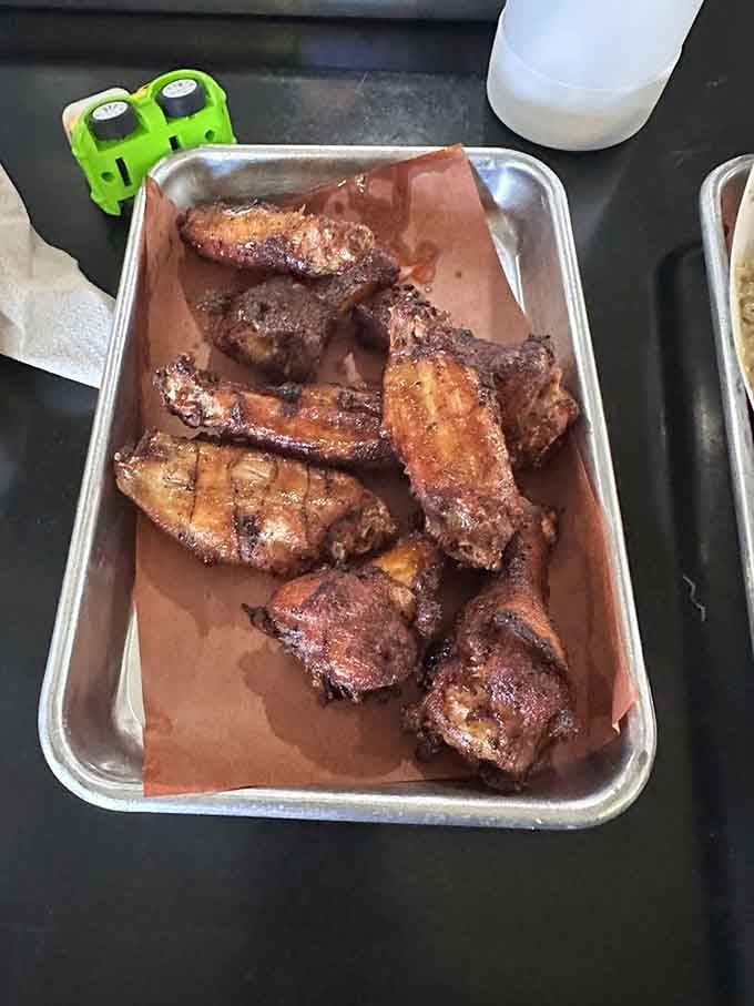 Wings with that deep mahogany color that only comes from serious time in the smoker, not your average chicken.