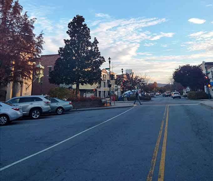 Main Street at dusk whispers promises of good dinners and easy parking, two things that should never be taken for granted.