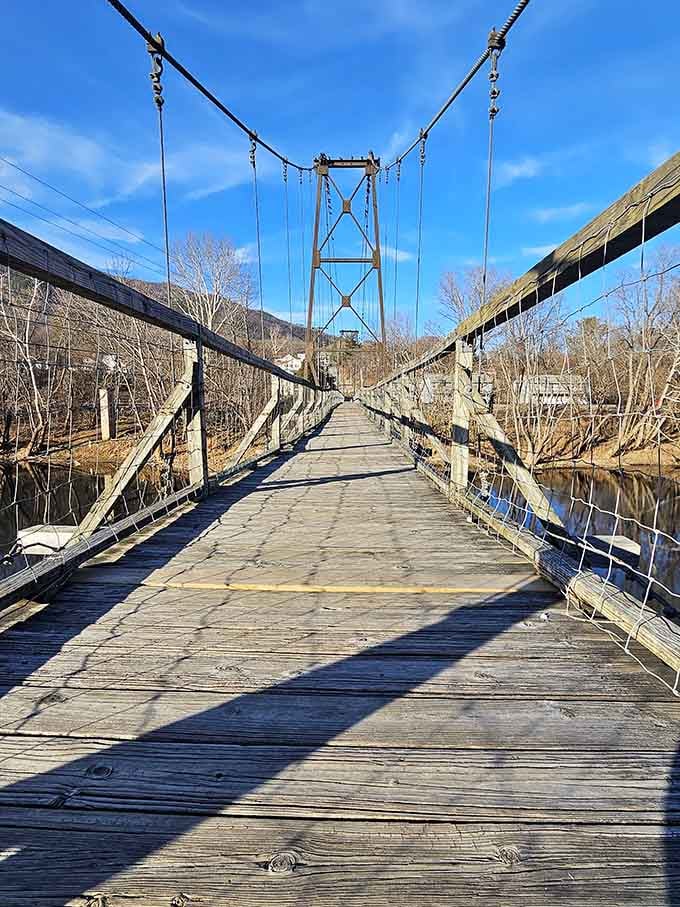 Those wooden planks have supported countless footsteps, each one adding to the bridge's swaying character and charm.