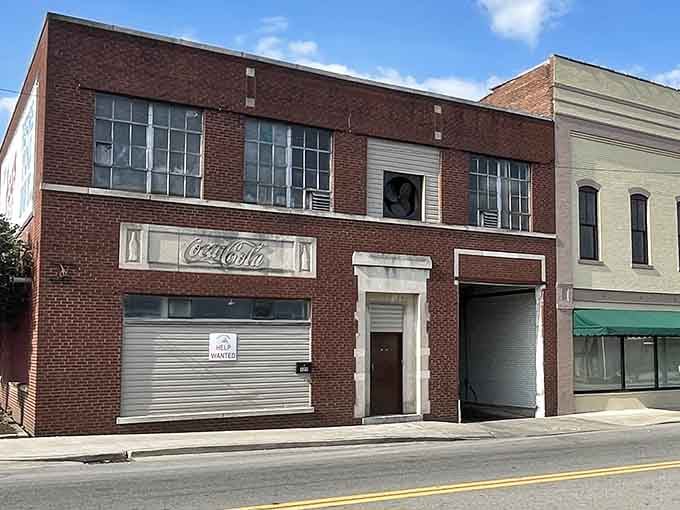 That vintage Coca-Cola sign whispers stories from decades past, when Main Street was America's shopping center.