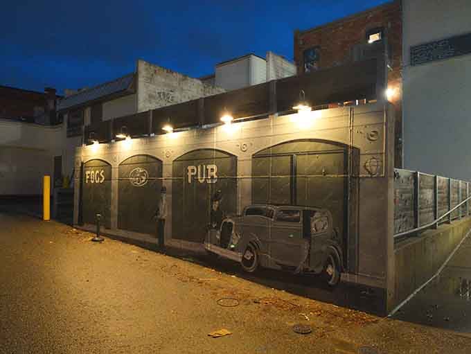 Evening lights illuminate a pub facade that practically begs you to come in and stay awhile, friend.