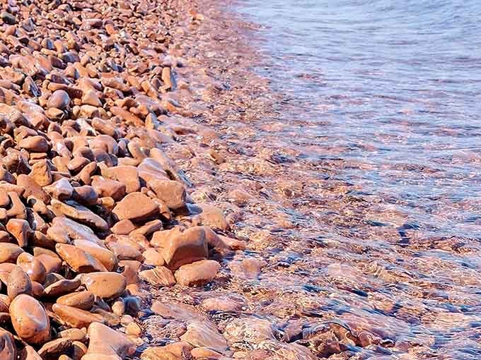 Each wave polishes these ancient volcanic stones, creating nature's most soothing percussion section you'll ever hear.