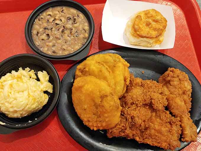 Fried chicken, black-eyed peas, mashed potatoes, and a biscuit create the Southern plate of your absolute dreams right here.