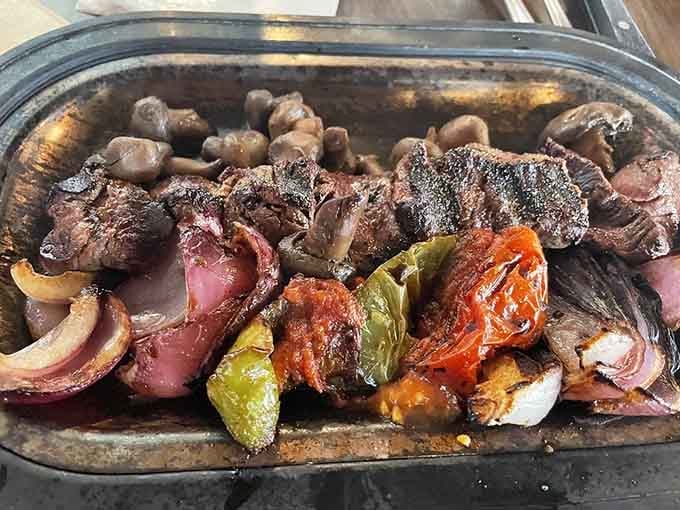 Steak kabobs loaded with peppers and mushrooms offer all the flavor without the fancy steakhouse attitude.