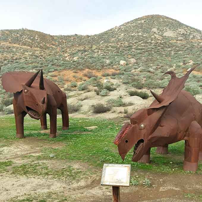 These metal dinosaurs look ready to graze, proving that even prehistoric creatures appreciate a well-manicured lawn.